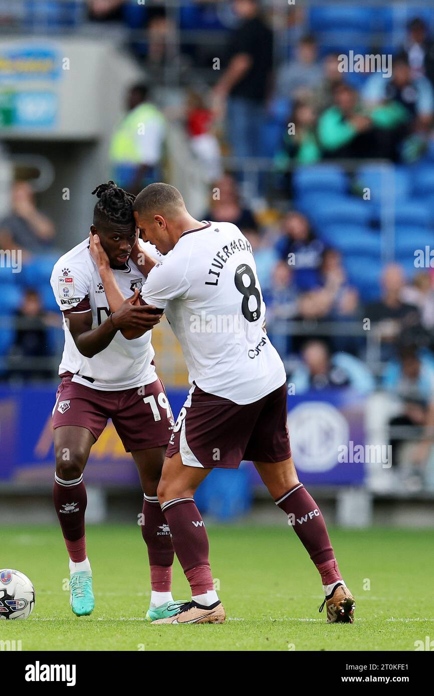 Cardiff, UK. 07th Oct, 2023. Vakoun Bayo of Watford (l) celebrates with ...