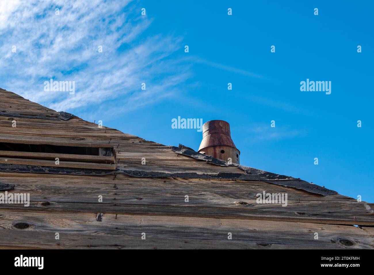 Metal chimney on the roof of an abandoned shack in the Nevada desert ...