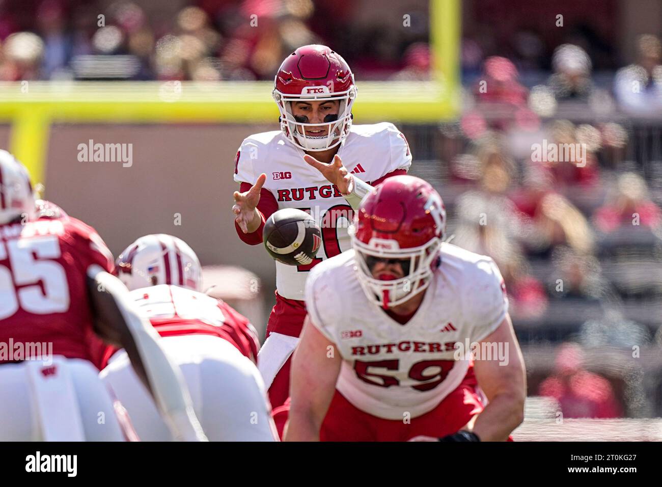 Rutgers quarterback Evan Simon (10) takes a snap against Wisconsin ...