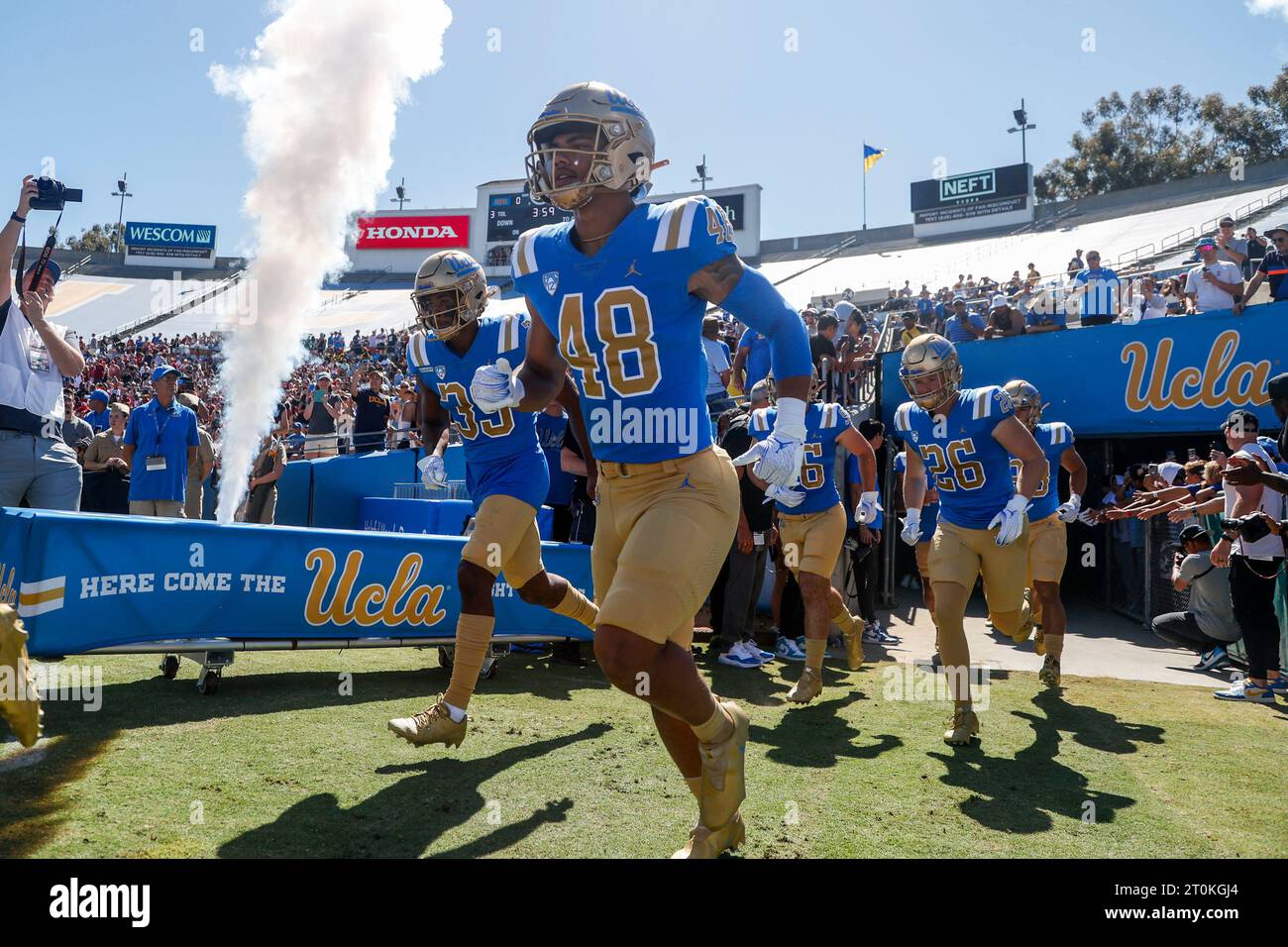 Pasadena, California, USA. 7th Oct, 2023. UCLA players run out of the ...