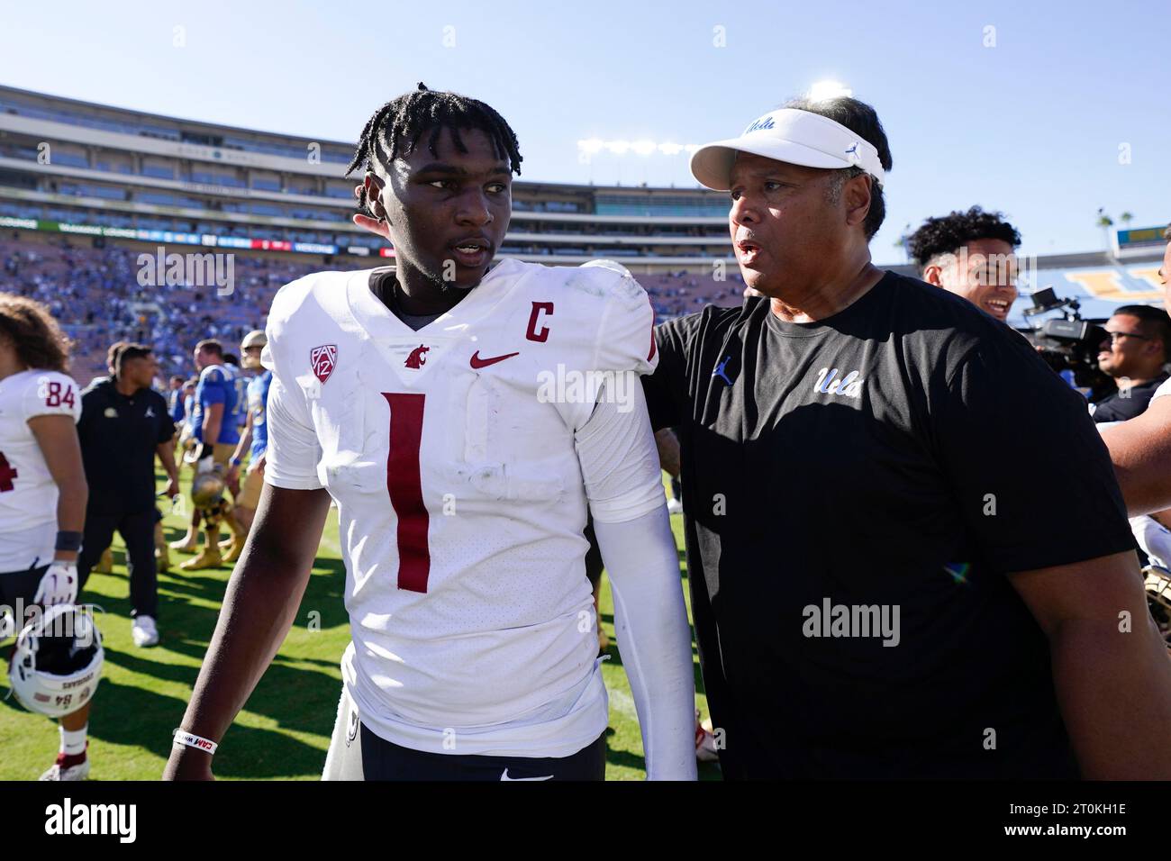 UCLA advisor Ken Niumatalolo, right, greets Washington State ...