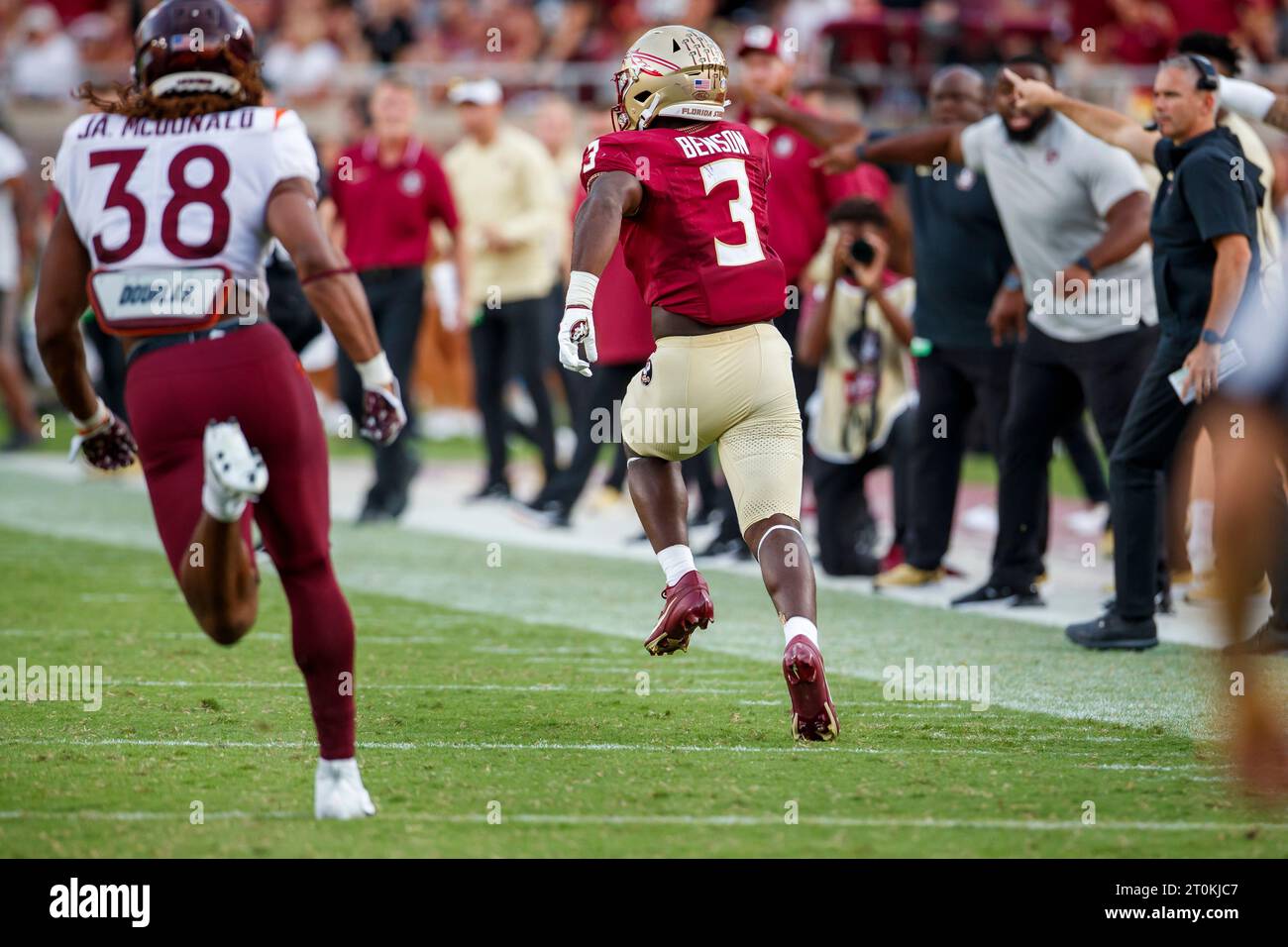 Florida State running back Trey Benson (3) takes off on an 85-yard touchdown run as Virginia ...