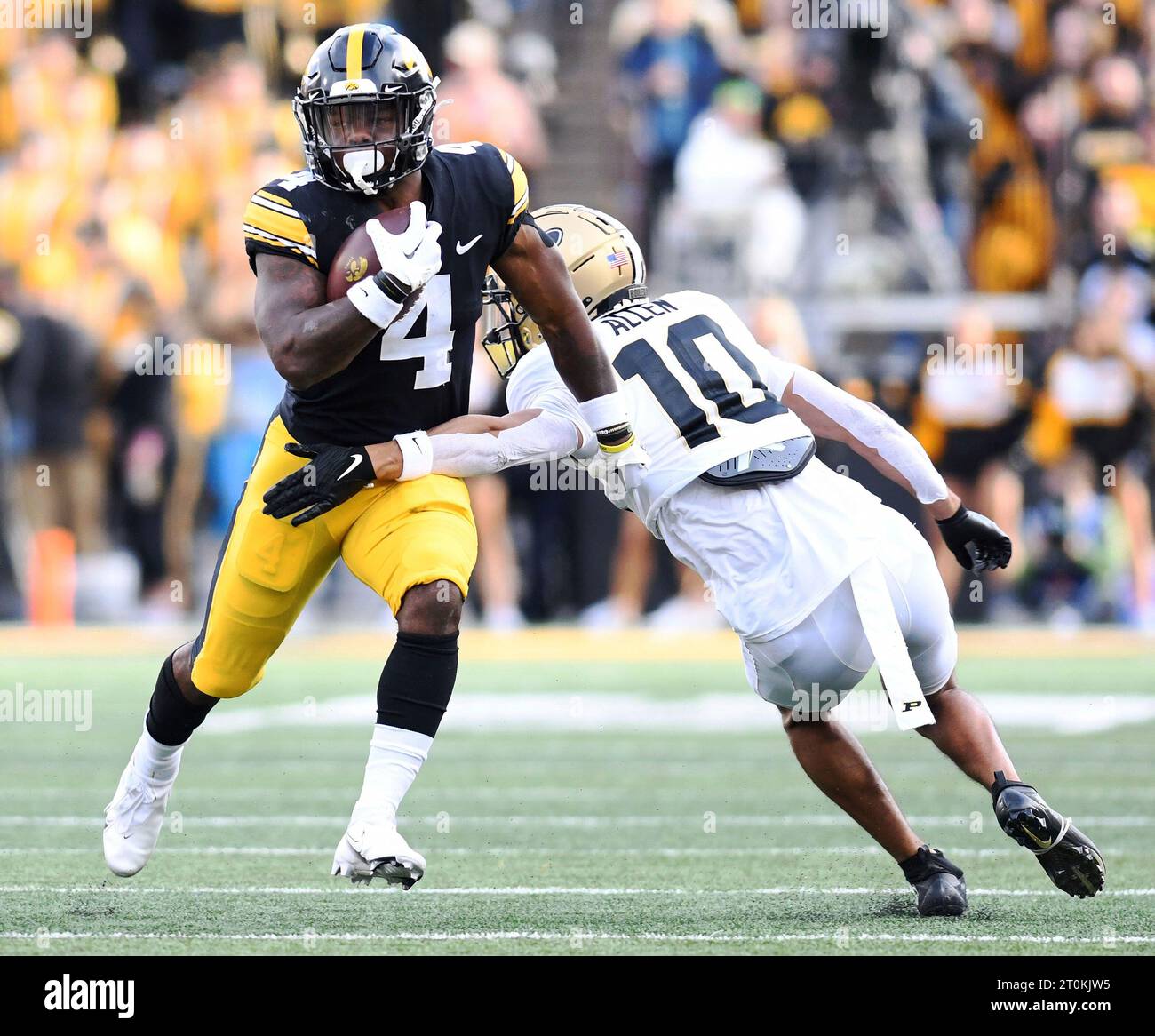 Iowa running back Leshon Williams (4) evades a tackle by Purdue ...