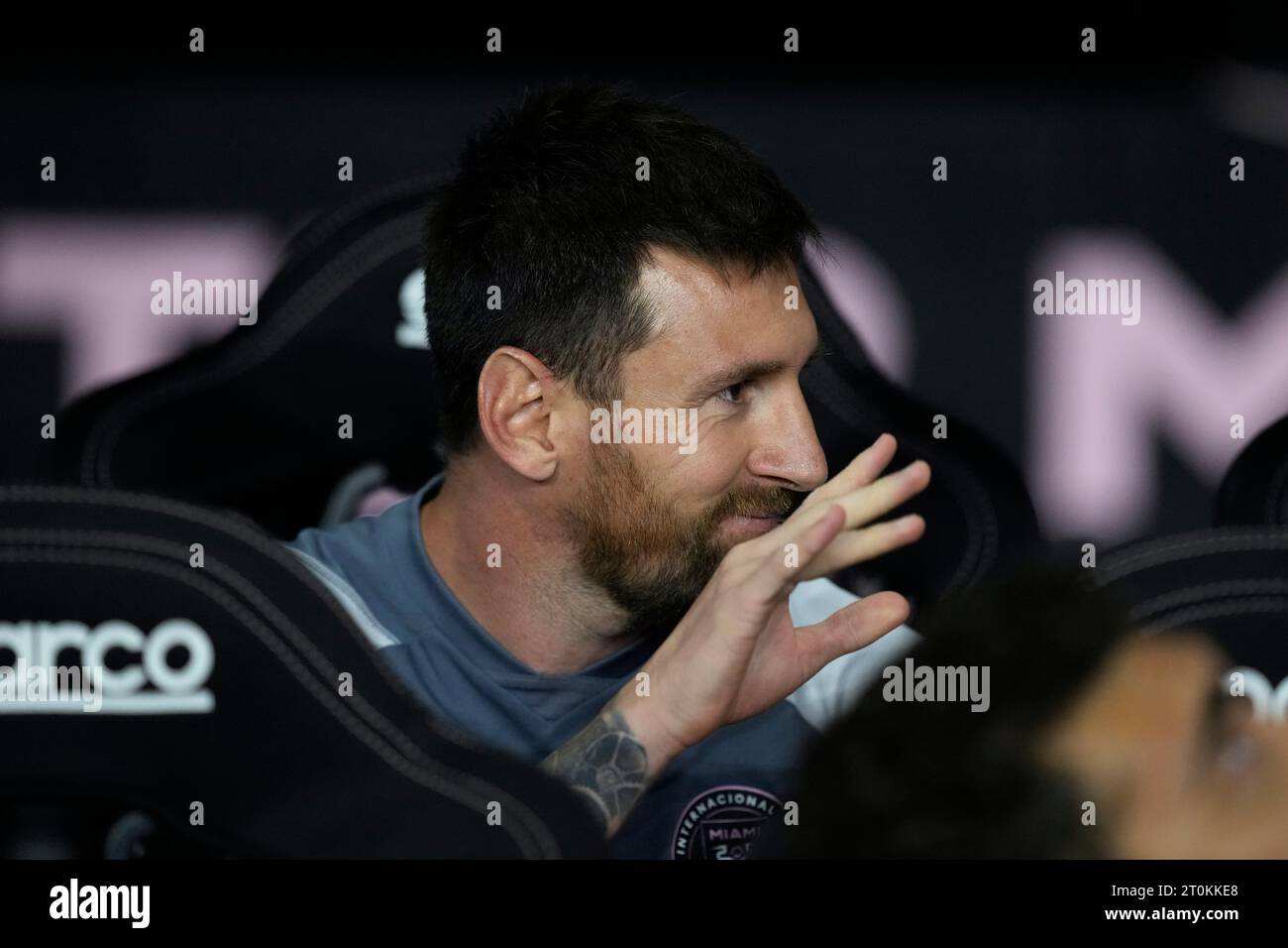 Inter Miami forward Lionel Messi waves to a friend as he sits on the ...