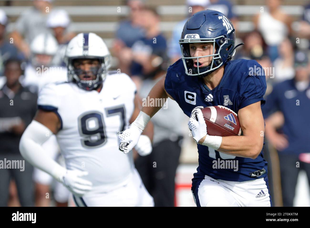 Rice wide receiver Luke McCaffrey, right, makes a gain in front of ...