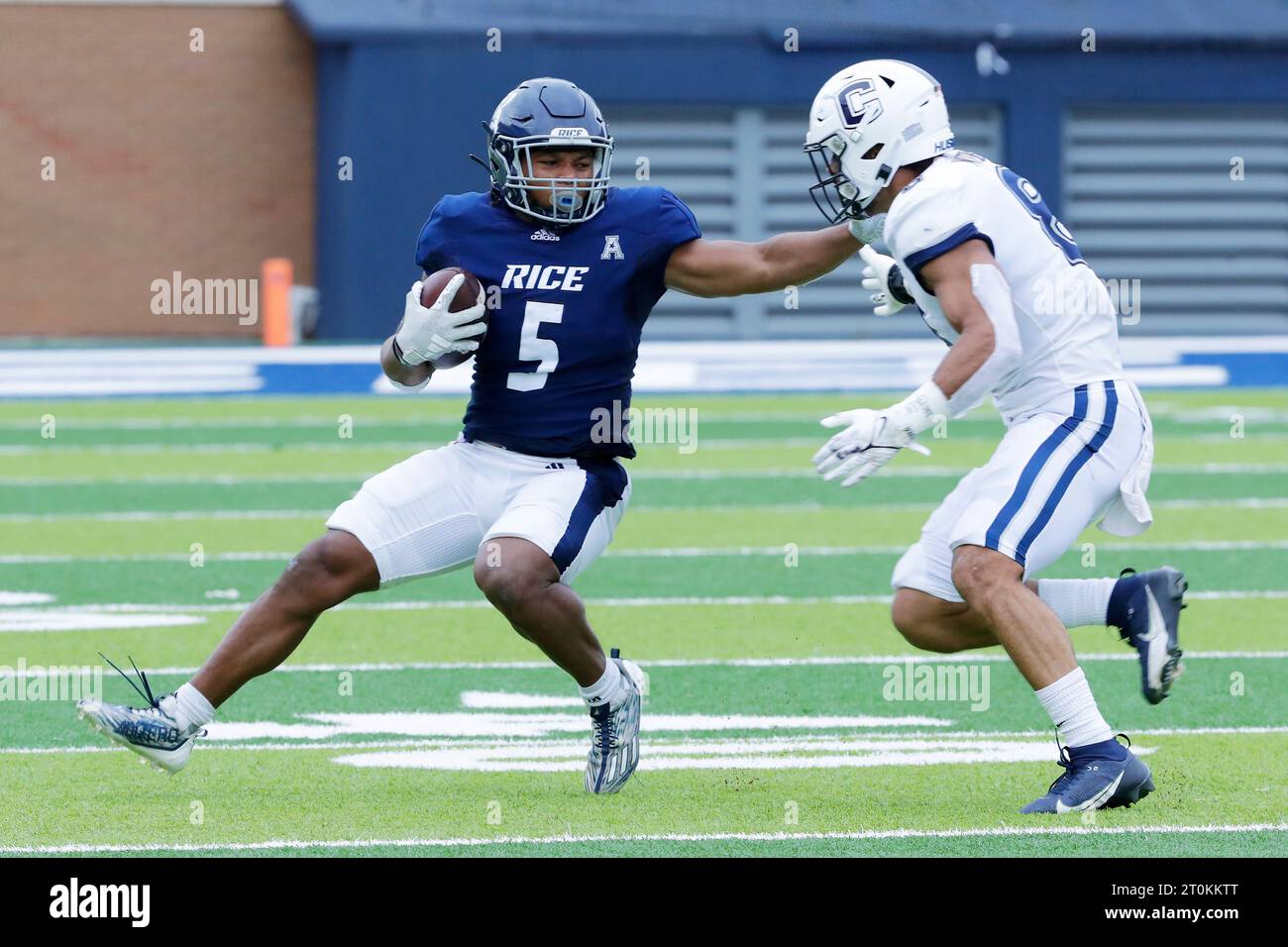 Rice running back Ari Broussard (5) pushes off the tackle attempt by ...