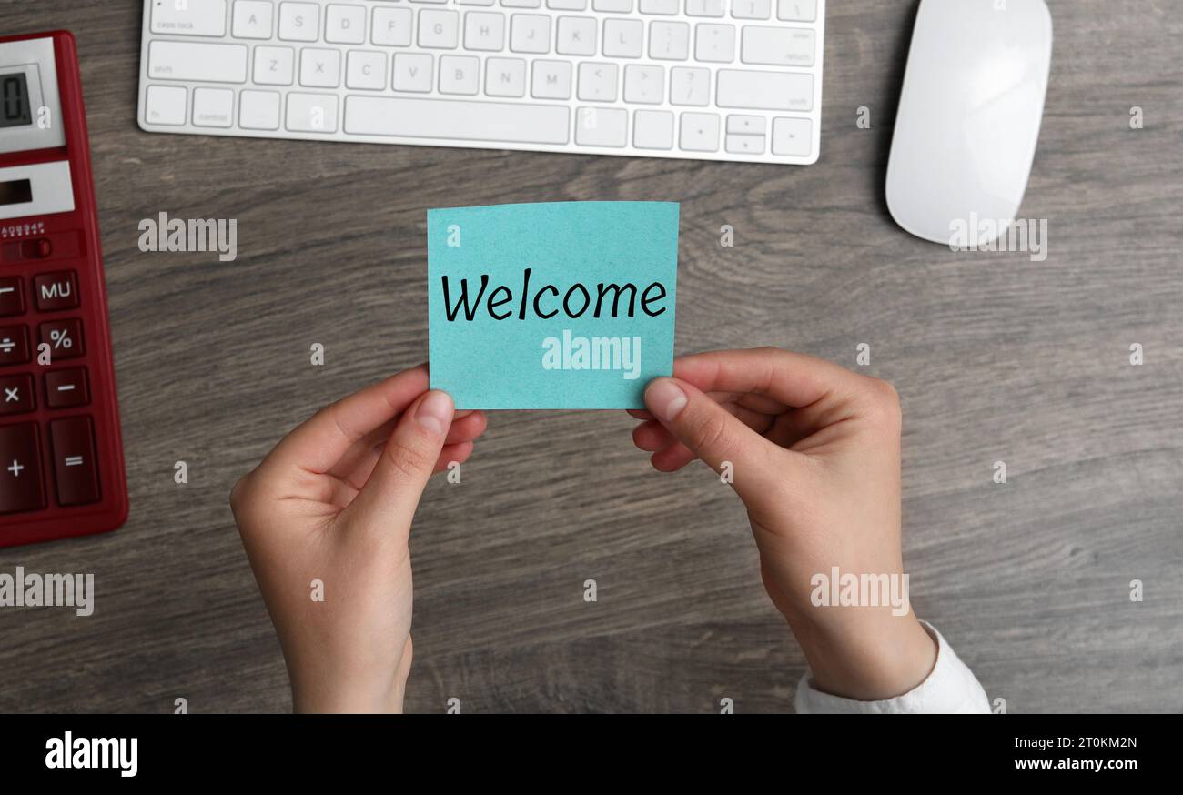 Welcome concept hands holding paper hi-res stock photography and images ...
