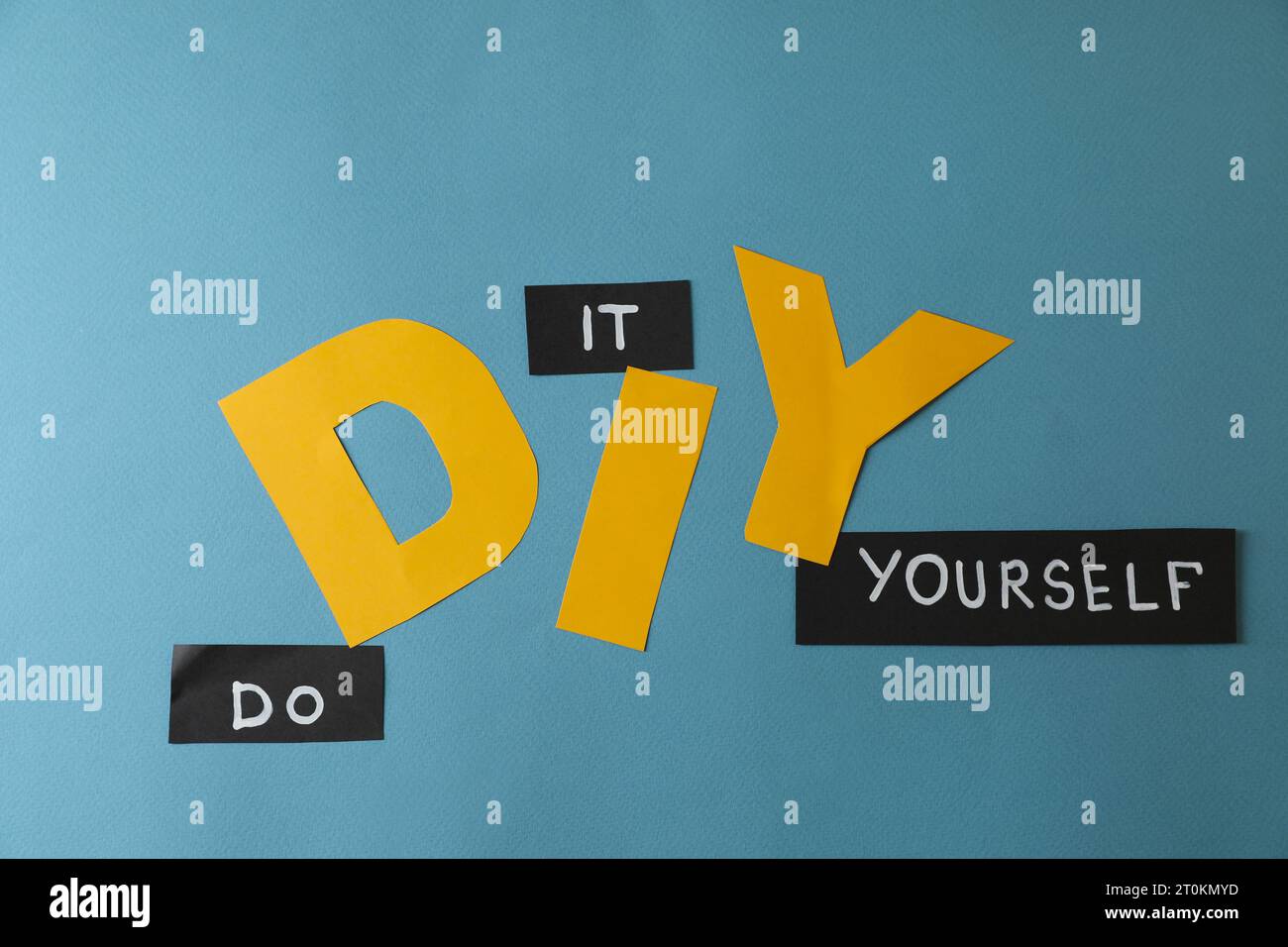 Phrase Do It Yourself and abbreviation DIY made of letters on light ...