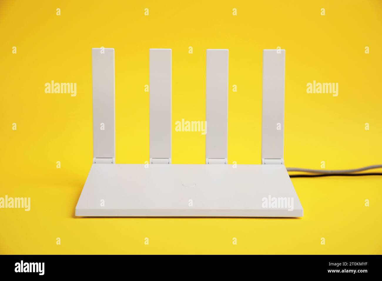 One modern Wi-Fi router on yellow background Stock Photo - Alamy