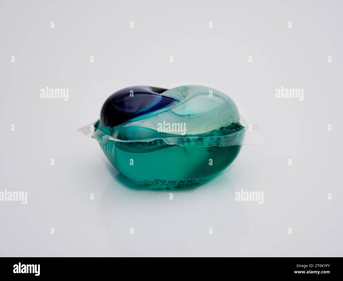 washing machine detergent capsule on a white background Stock Photo - Alamy