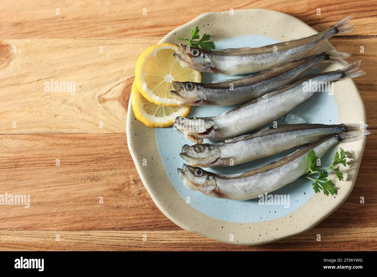 Frozen Capelin Shisamo Fish on Wooden Table, Top View Stock Photo - Alamy