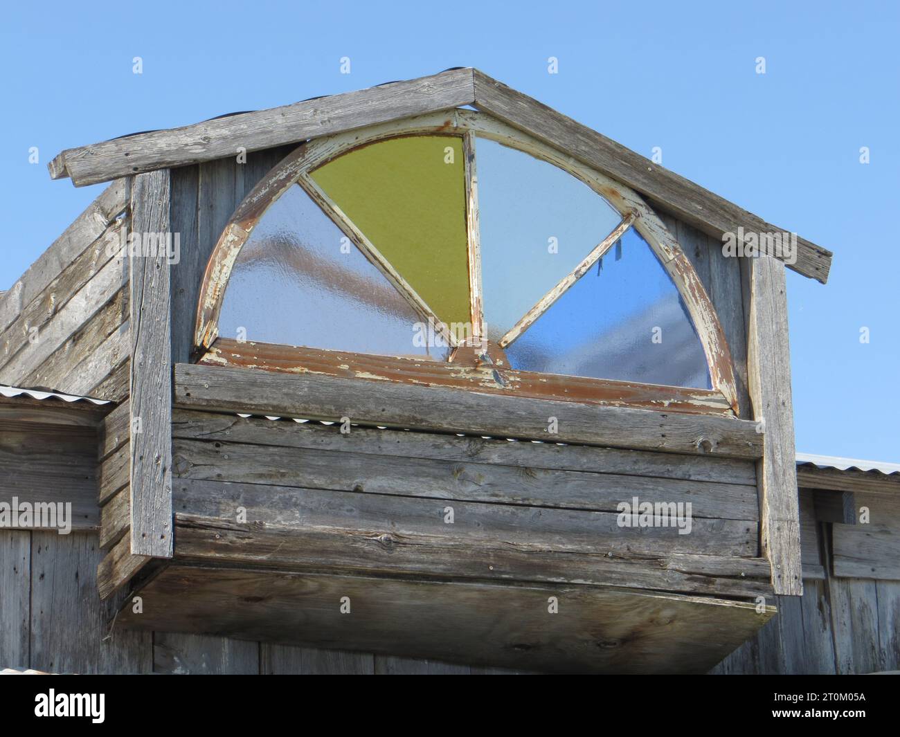 Old glass windows on a wooden building Stock Photo - Alamy