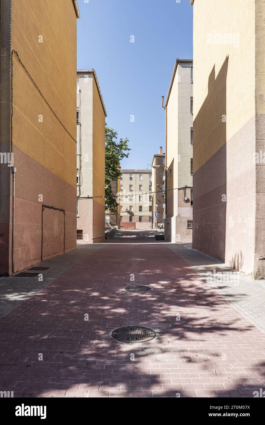 Pedestrian walk between identical residential buildings Stock Photo - Alamy