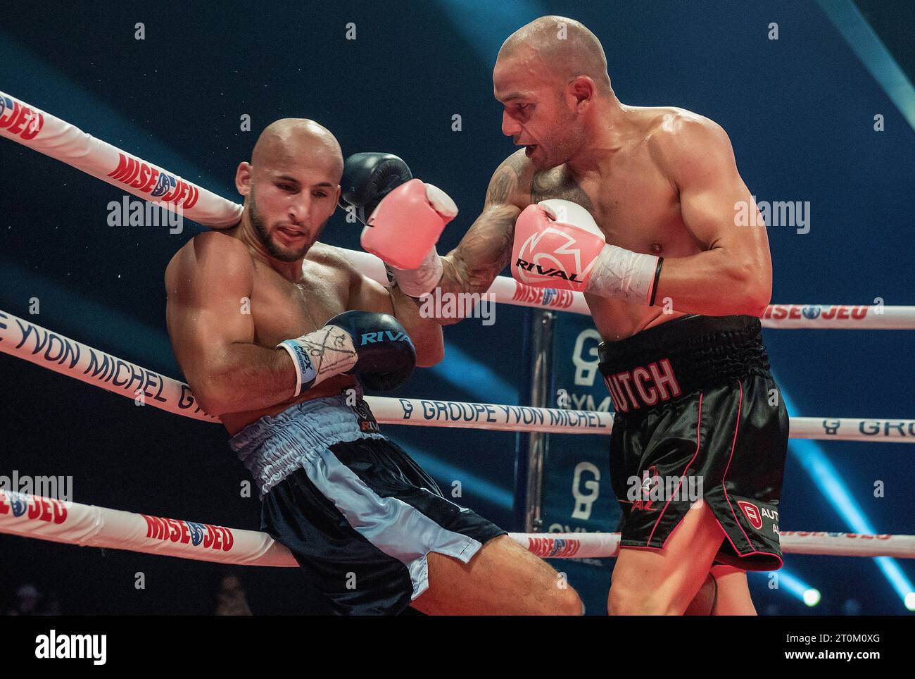 Sebastien Bouchard, right, follows through on a right to Mazlum Akdeniz ...
