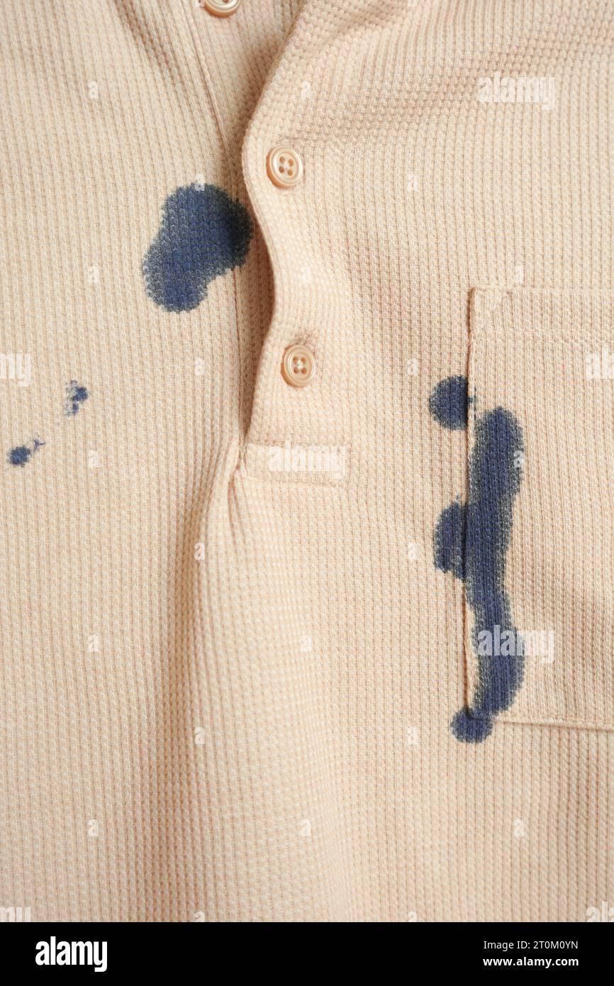 white shirt with blue ink stain Stock Photo - Alamy