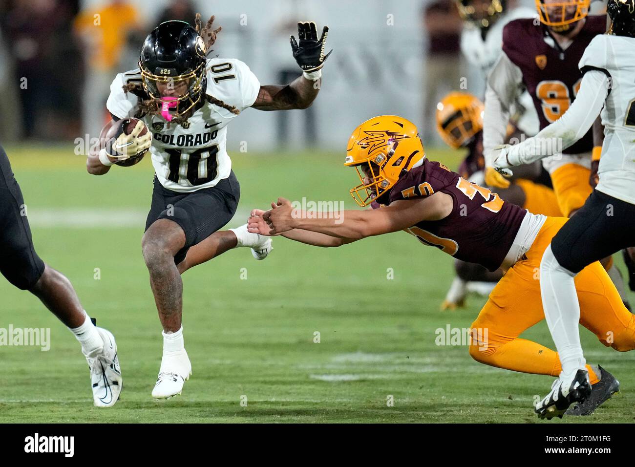 Colorado wide receiver Xavier Weaver (10) is tripped by Arizona State ...