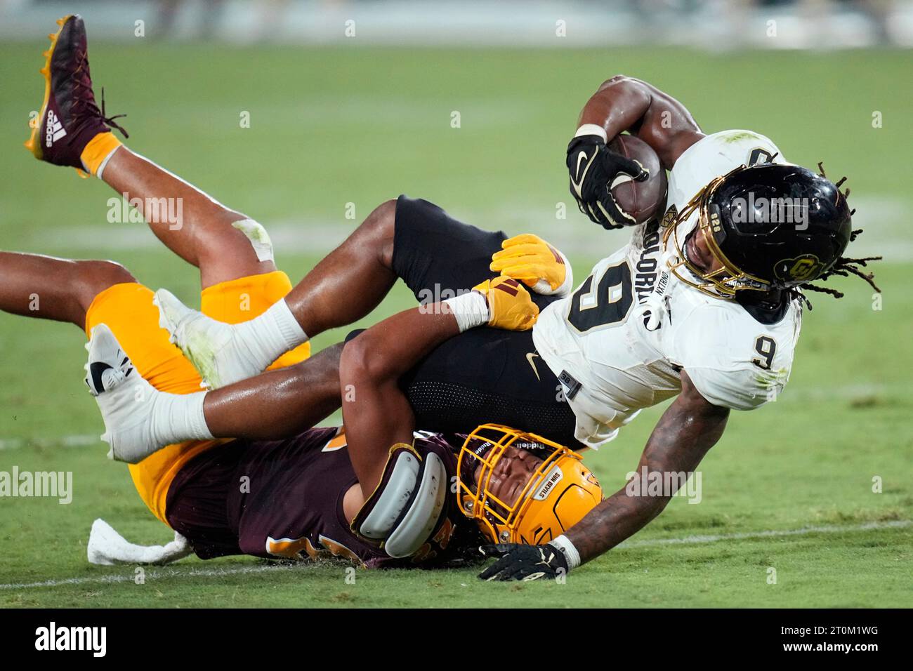 Colorado running back Anthony Hankerson (9) is tackled by Arizona State ...
