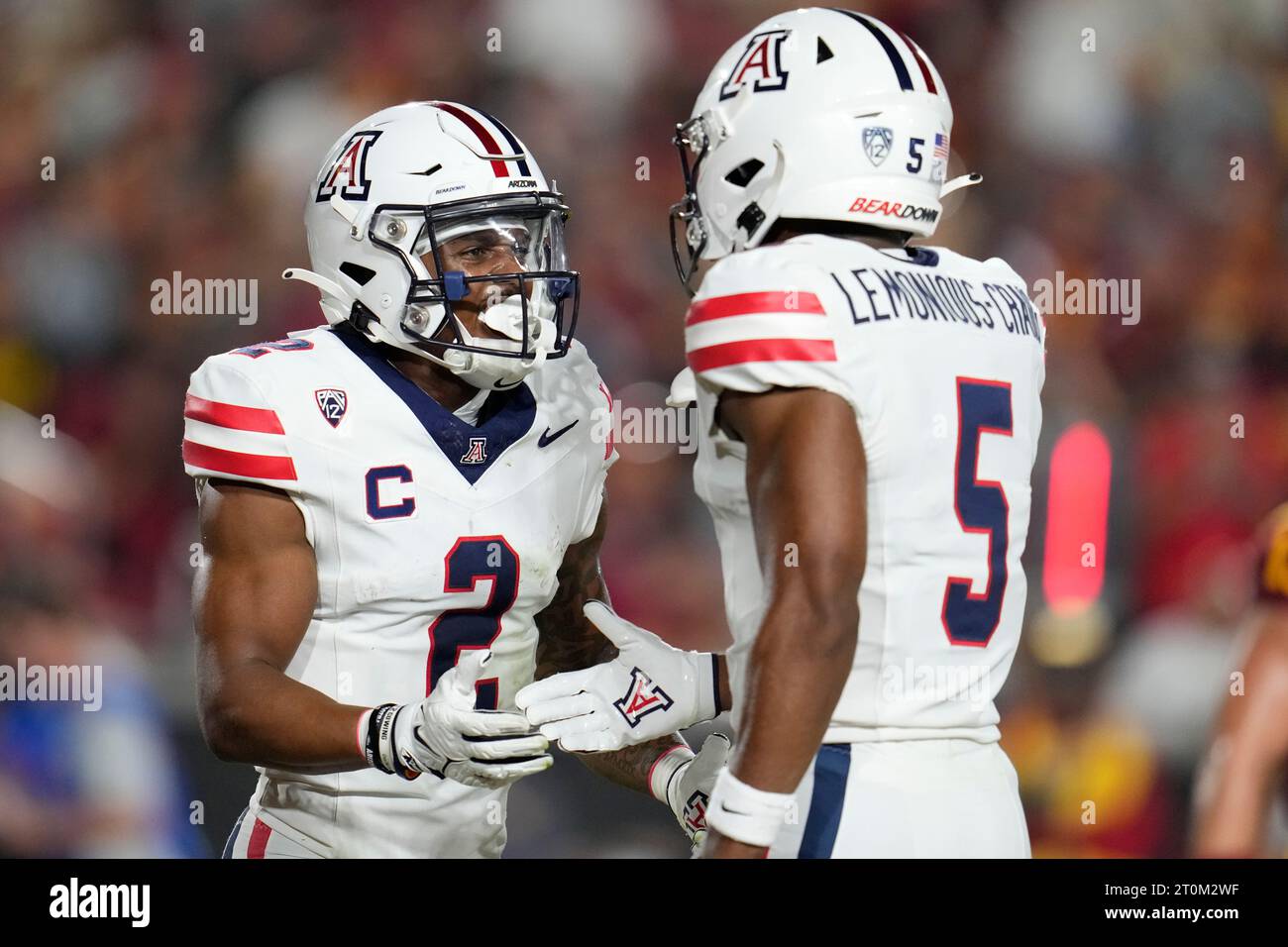 Arizona wide receiver Jacob Cowing (2) celebrates his touchdown catch ...