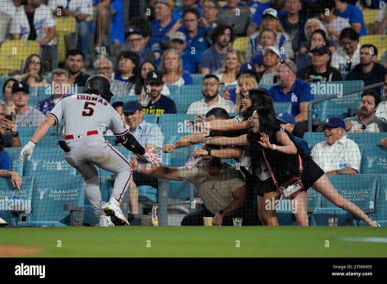Arizona Diamondbacks' Alek Thomas reaches out to fans after hitting a ...