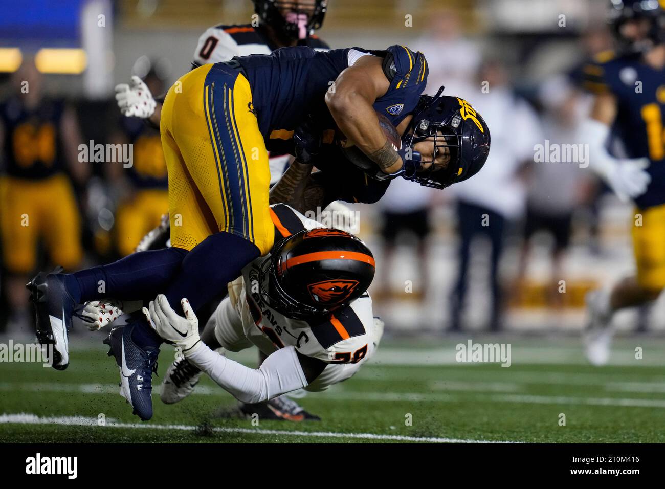 California running back Jaydn Ott, top, is tackled by Oregon State ...