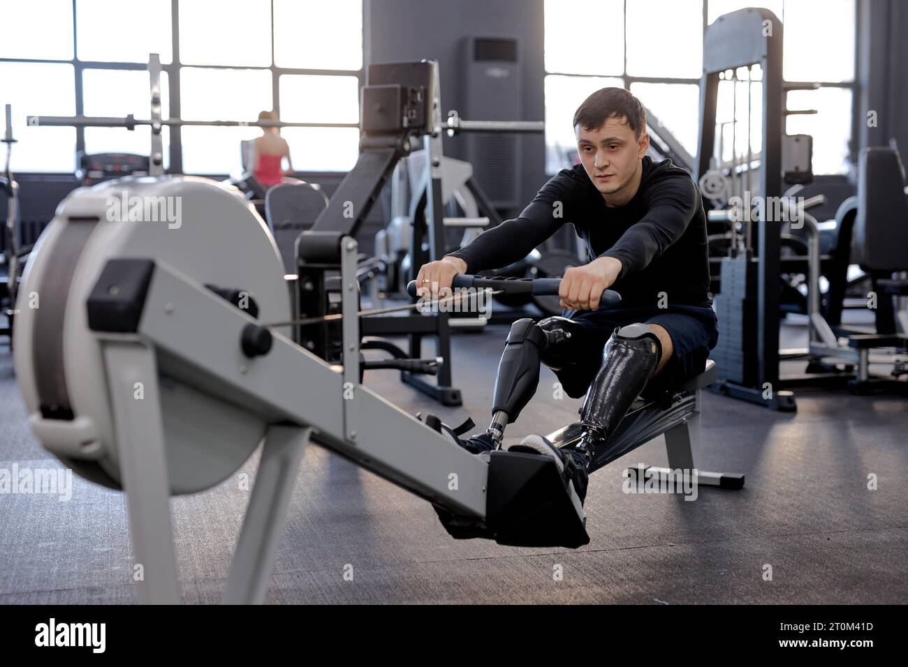 active guy performs exercises for Total Body, side view shot, strength ...
