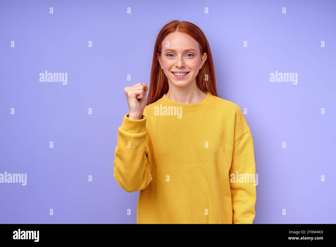 Young deaf mute woman using sign language on blue background, showing ...