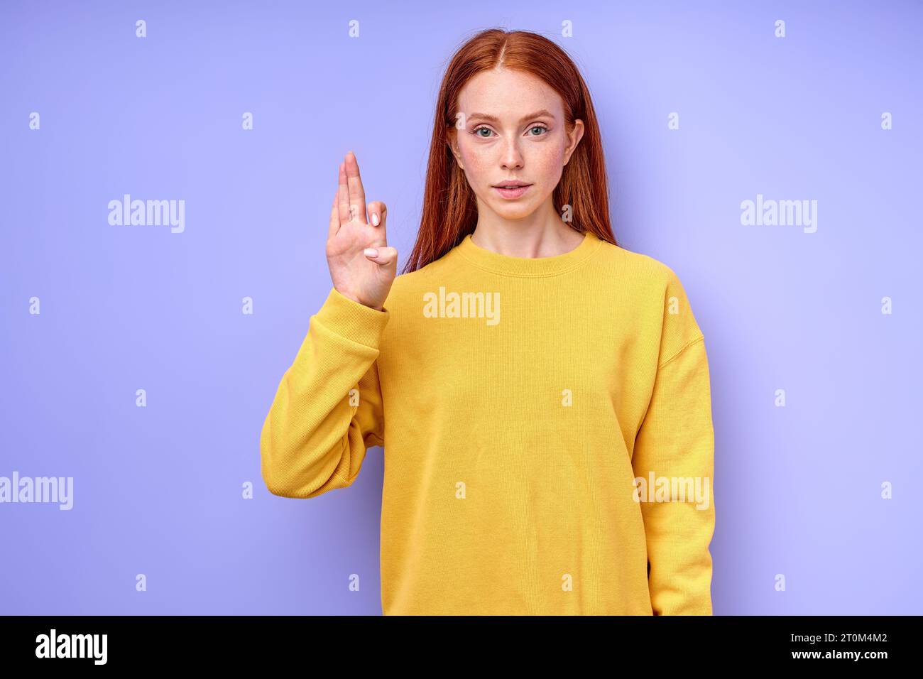 beautiful redhead woman demonstrating letter F sign language symbol for ...