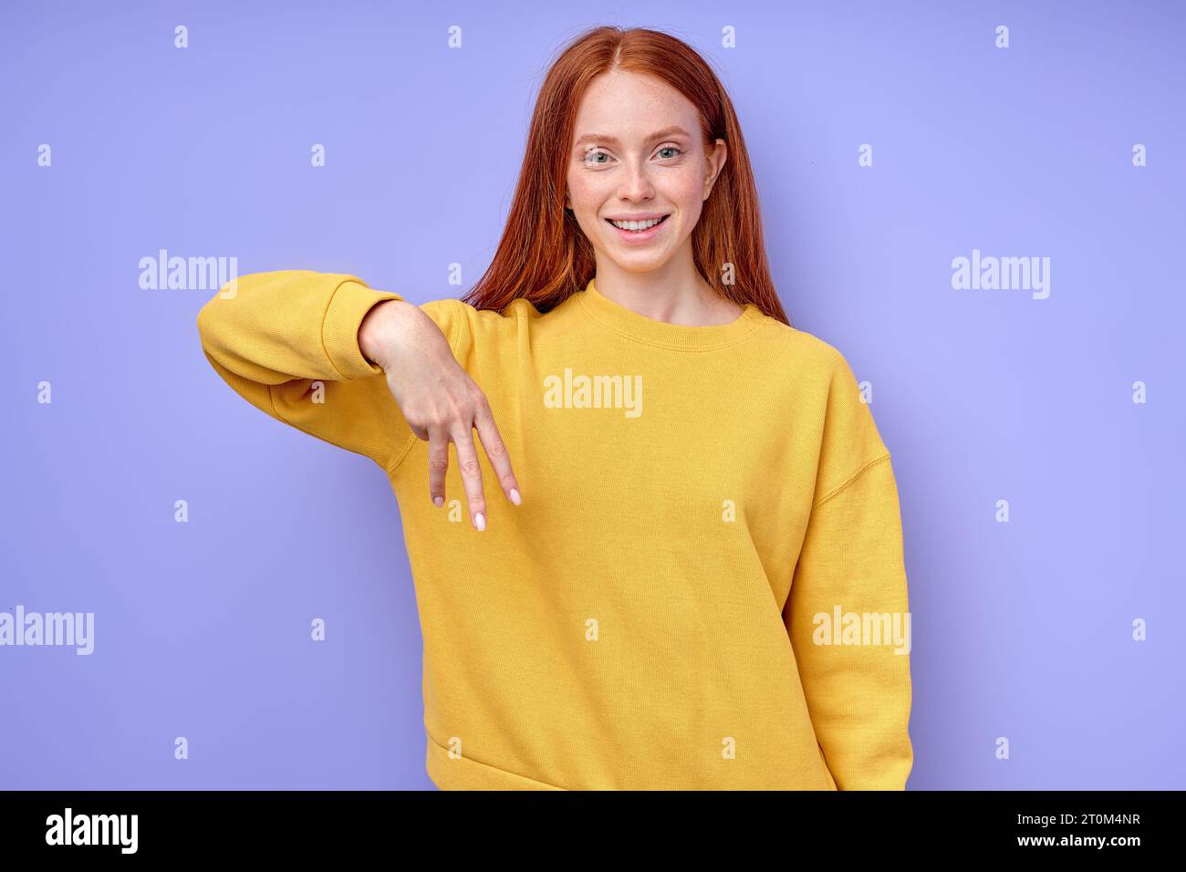 beautiful happy cheerful redhead woman in yellow stylish sweater ...