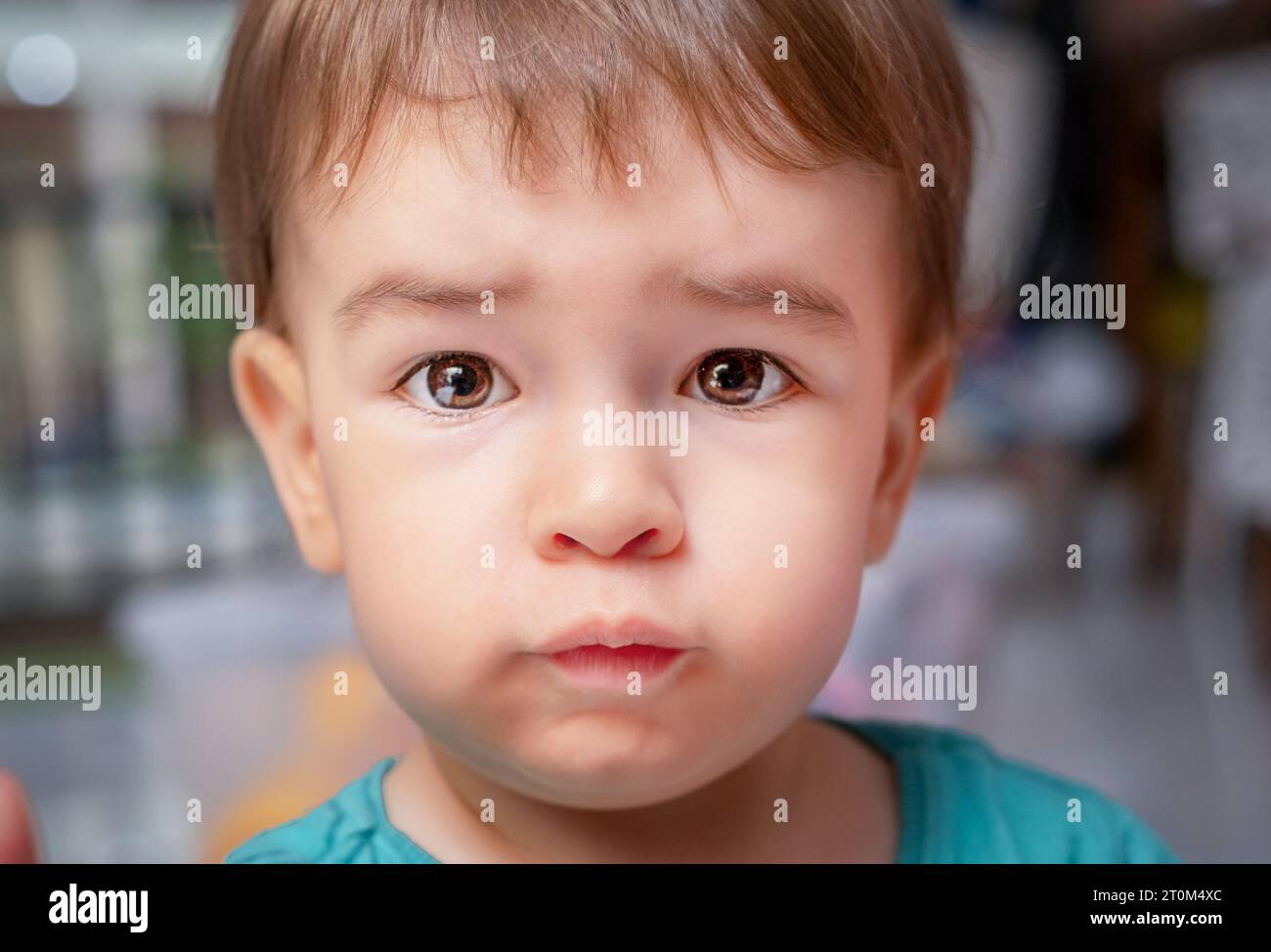 Portrait of a cute sad child looking at the camera close Stock Photo ...