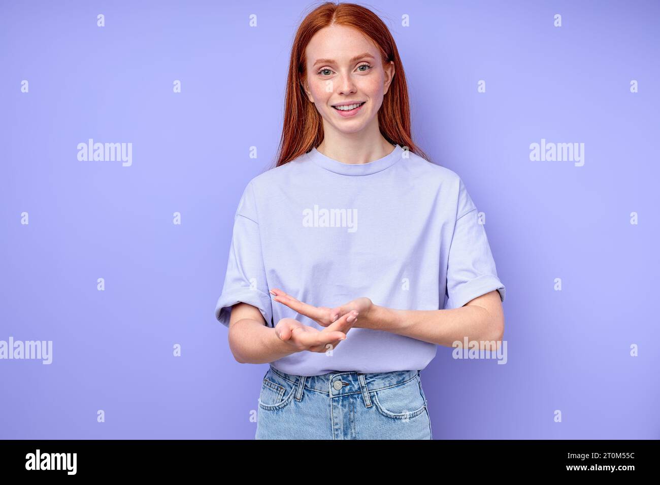 Young deaf red-haired redhead mute woman wants to show book, saying ...