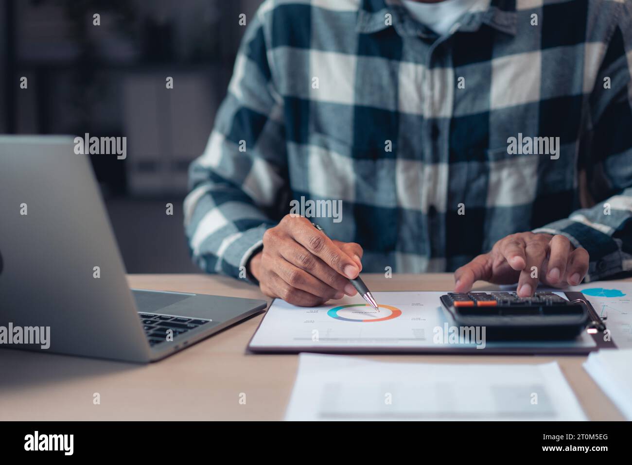 Businessman use calculator to calculation and checking financial and ...