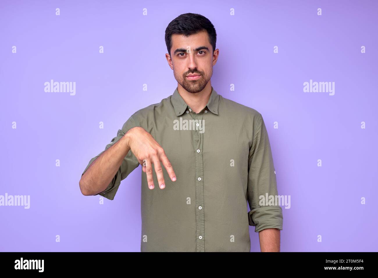 serious handsome man showing letter M m with fingers .the Alphabet in ...