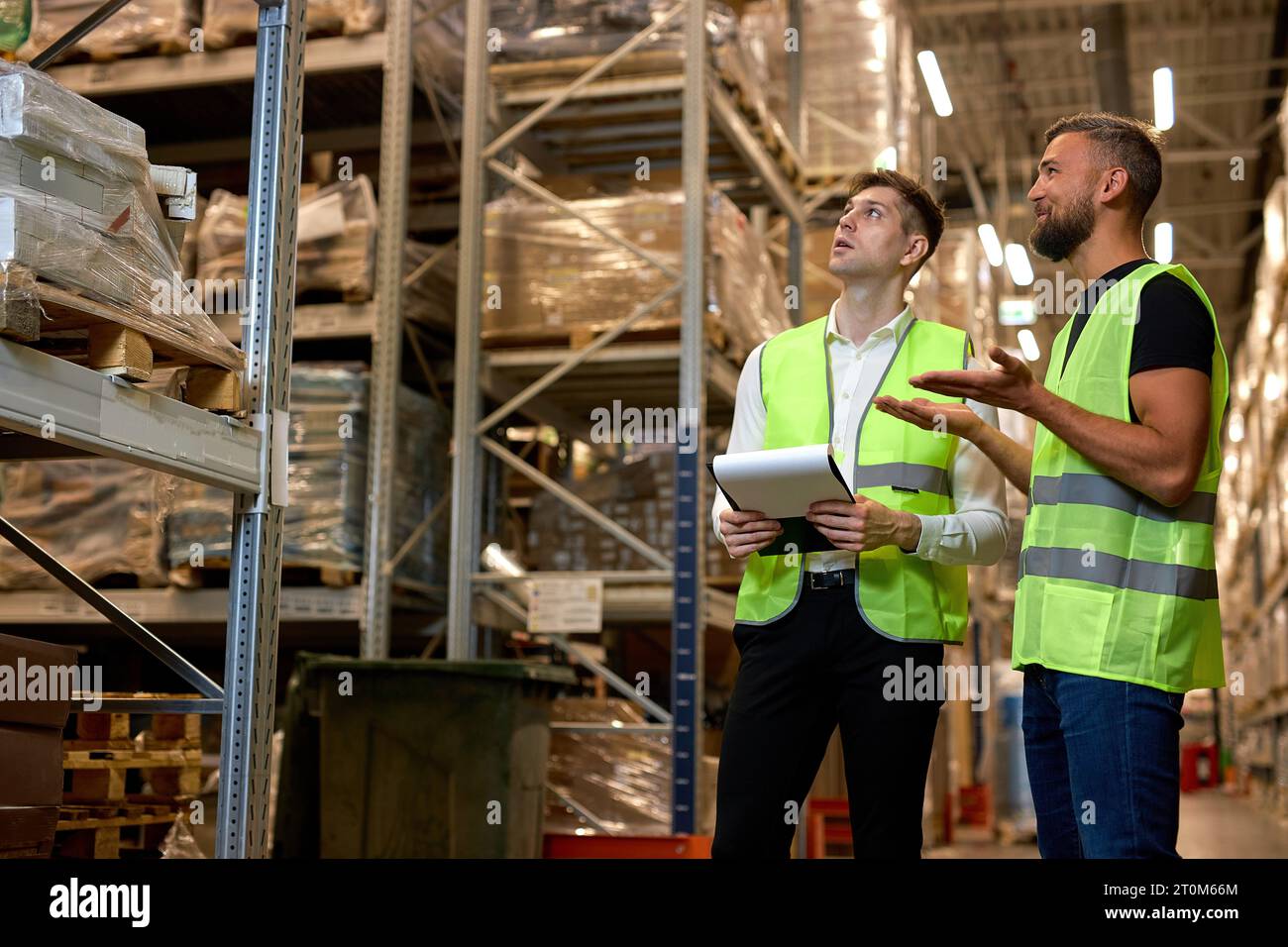 Men warehouse workers talking,warehouse industry and logistics concept ...