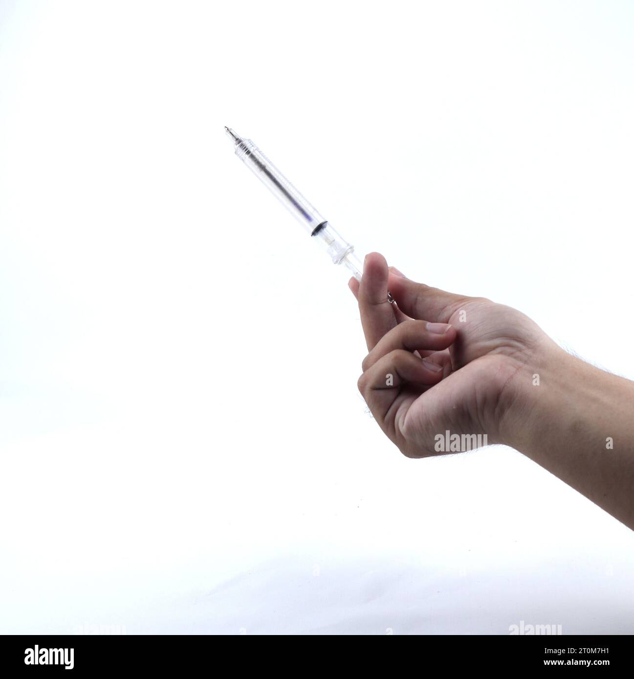 hand holding a small syringe Stock Photo - Alamy