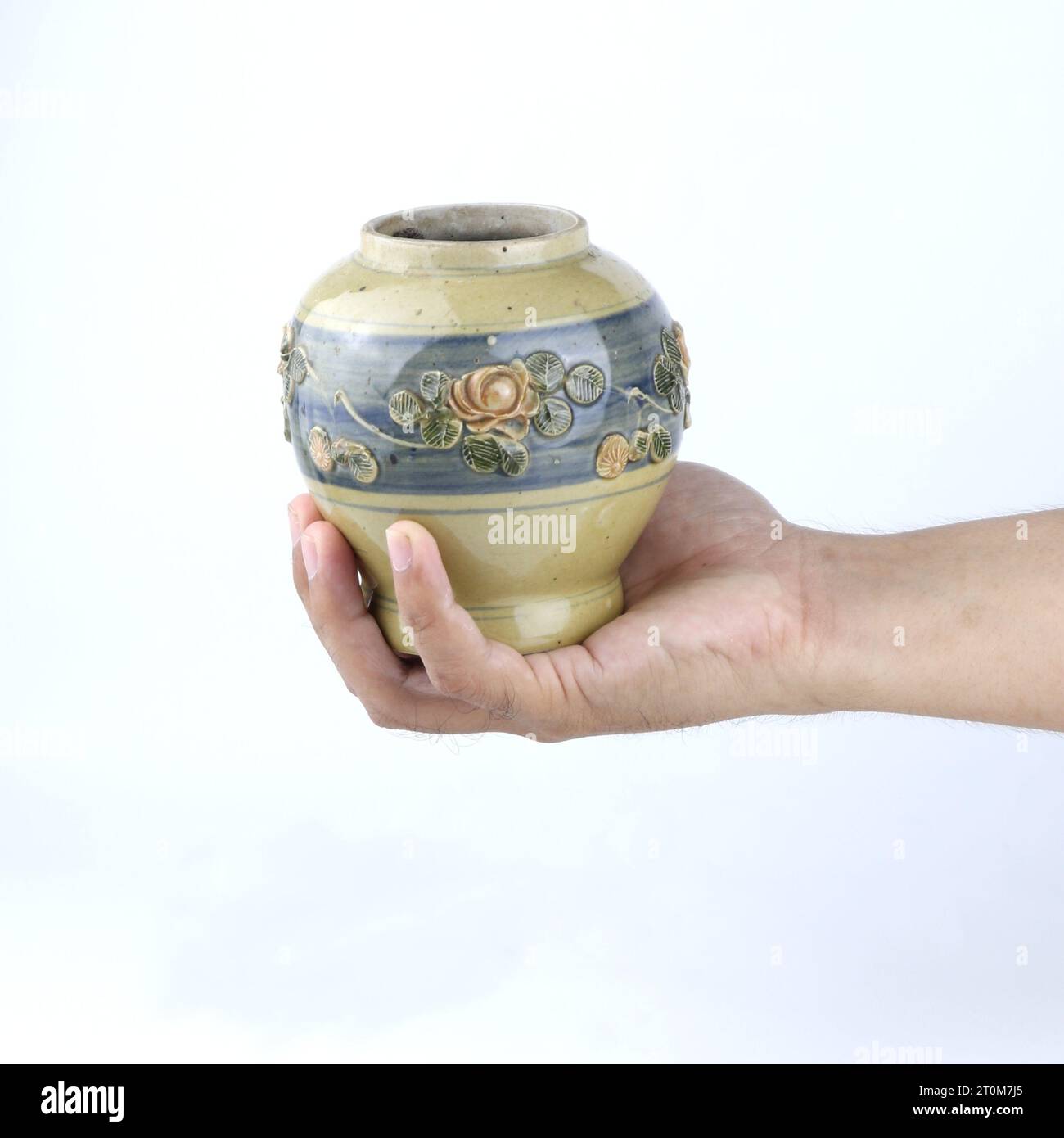 hand holding vintage ceramic vase Stock Photo - Alamy