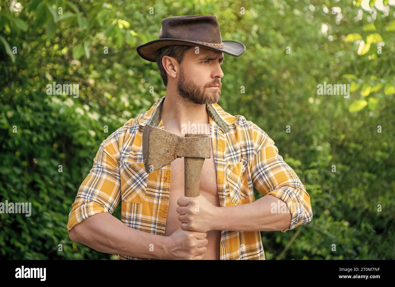 lumberjack with axe outside. lumberjack with axe wearing checkered ...