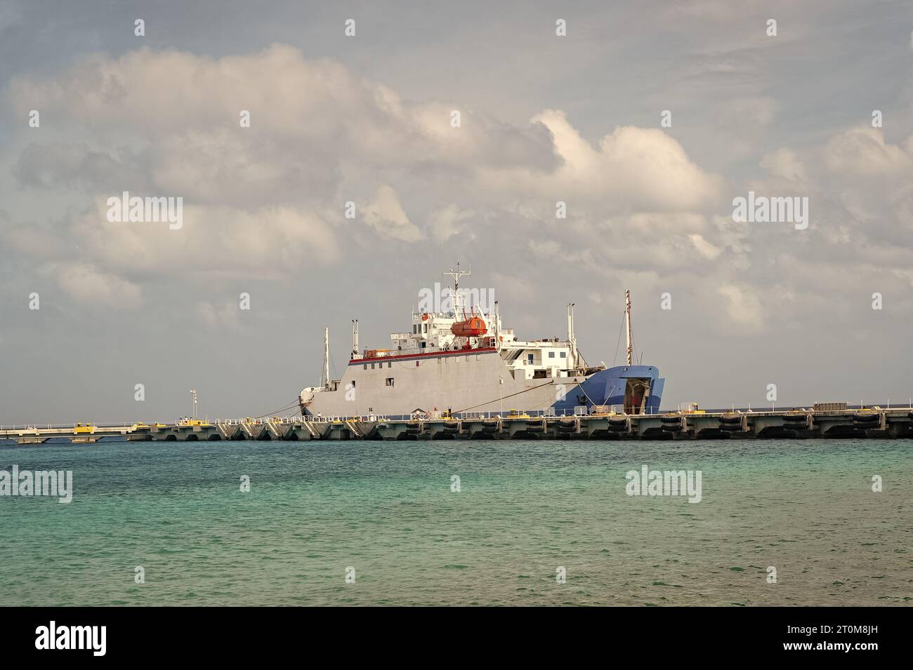 ferry ship in docked harbor, side view. ferry ship in harbor or seaport ...