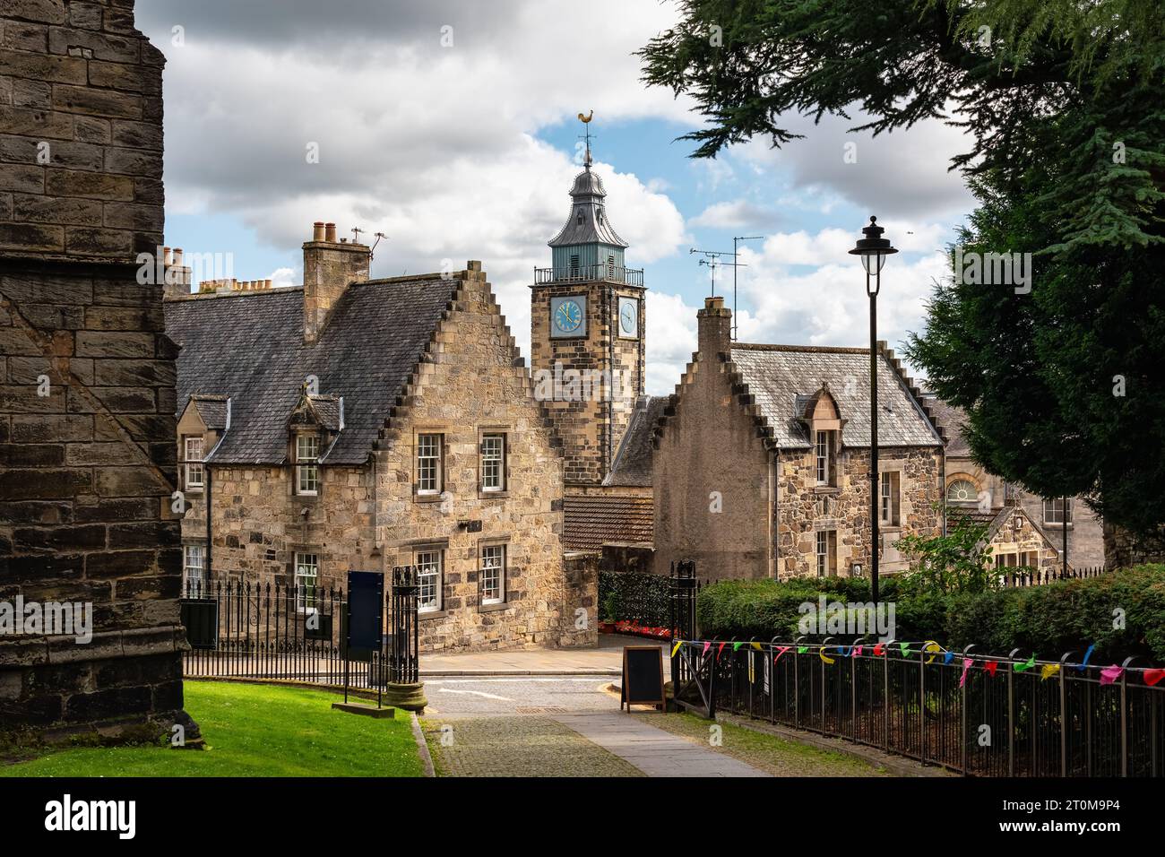 Old buildings with clock tower in the medieval city of Stirling ...