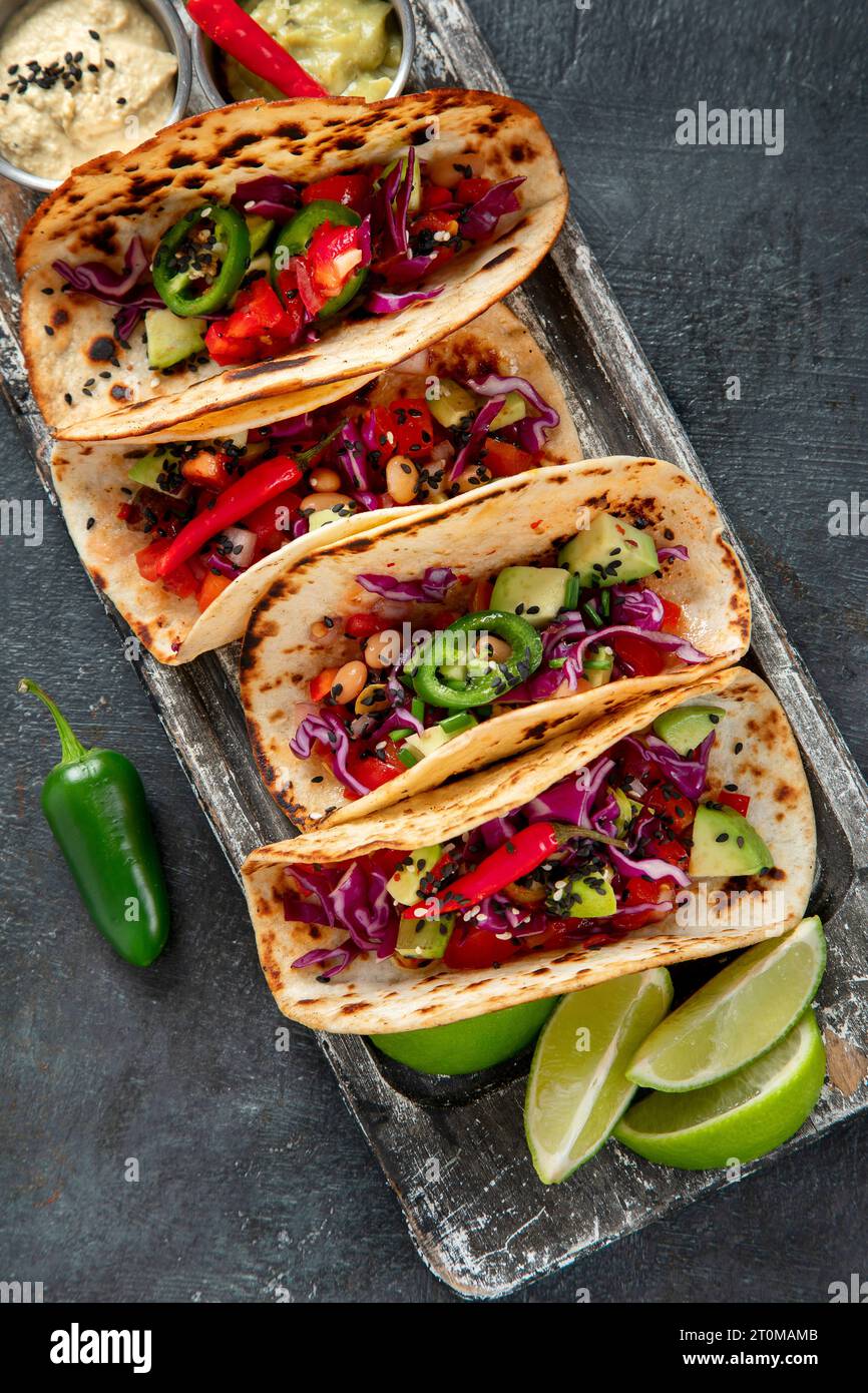 Mexican street tacos flat lay composition with lime, pepper and sauce ...
