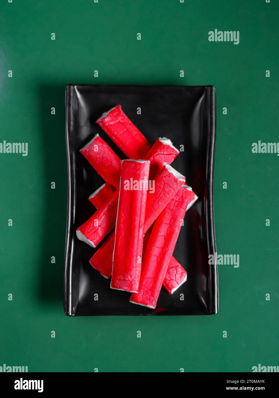 crab sticks on a green background. View from above. Chinese cuisine ...