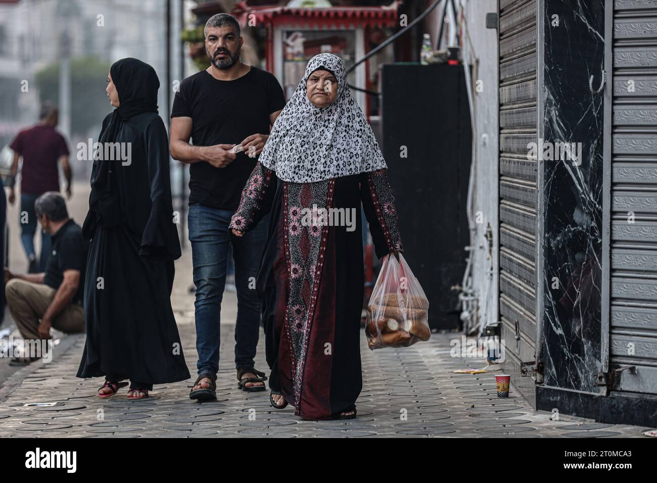 Gaza, Gaza, Palestine. 7th Oct, 2023. An elderly woman leaves her home ...