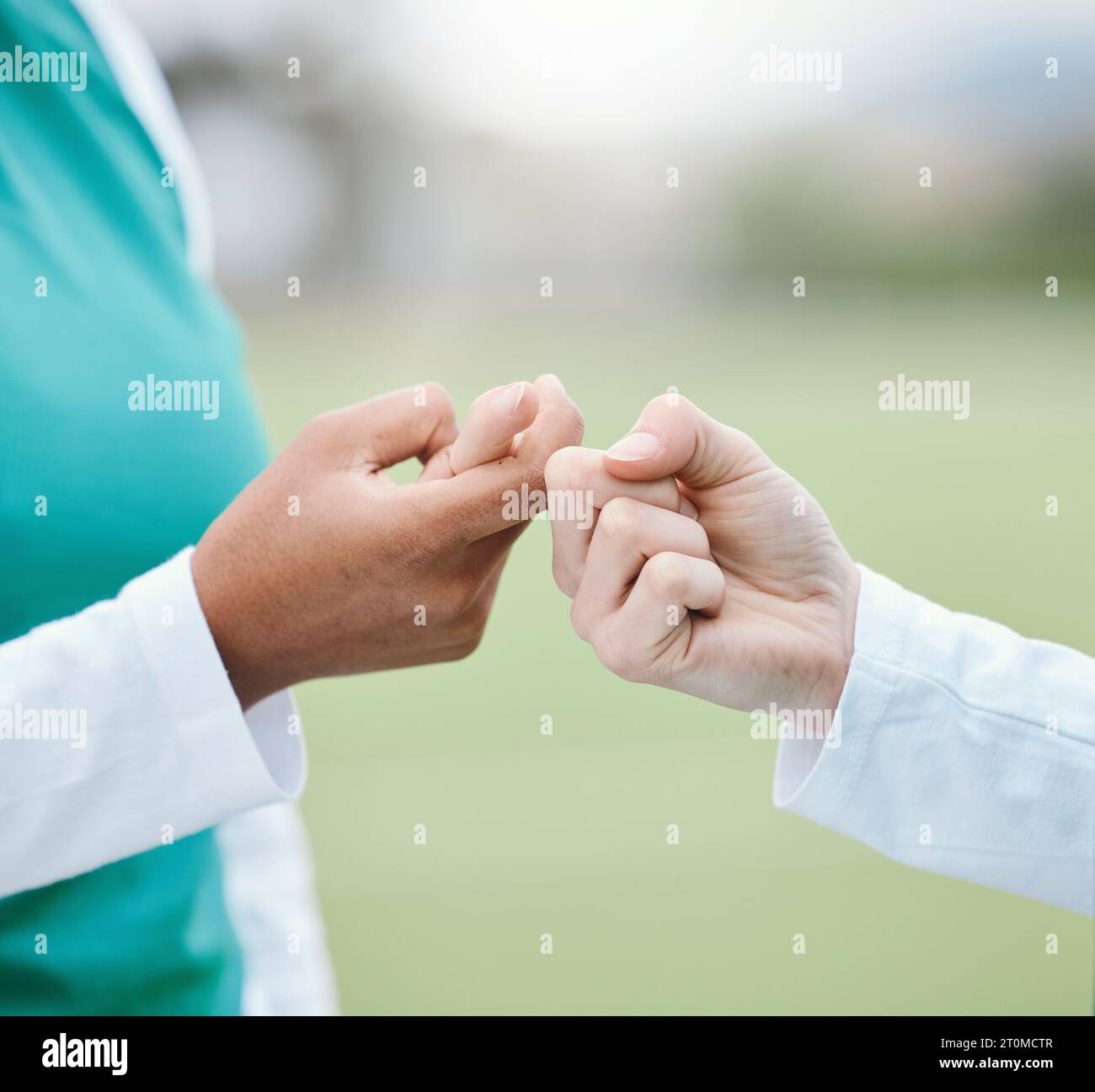 Hands, teamwork and unity with sports people closeup on a field or ...