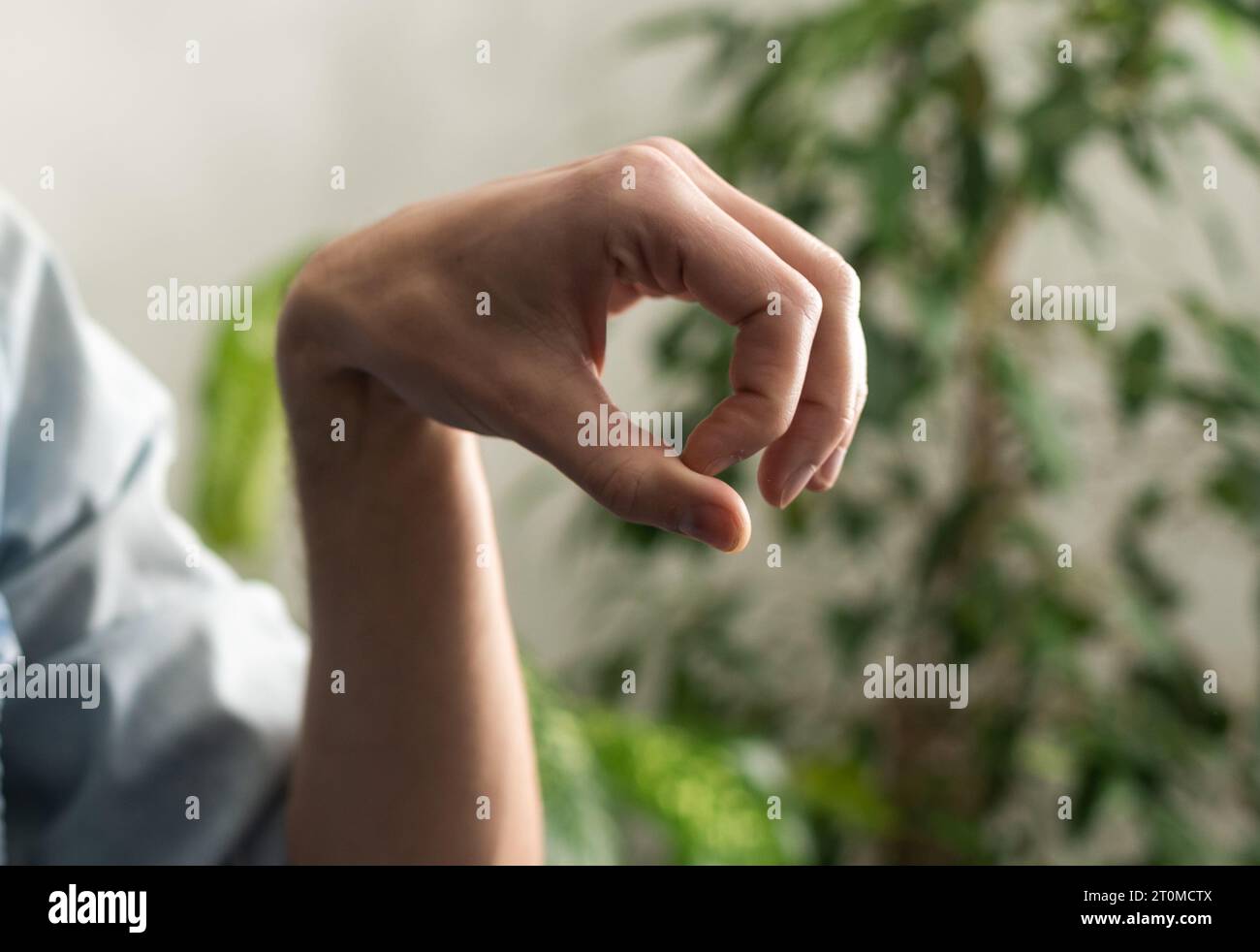 Adult Learning Sign Language For Deaf Disabled Stock Photo - Alamy