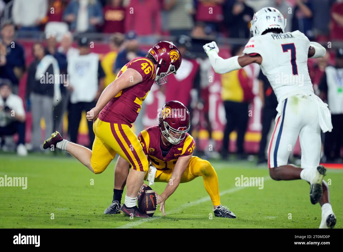 Southern California place holder Michael McAllister (35) tries to hold ...
