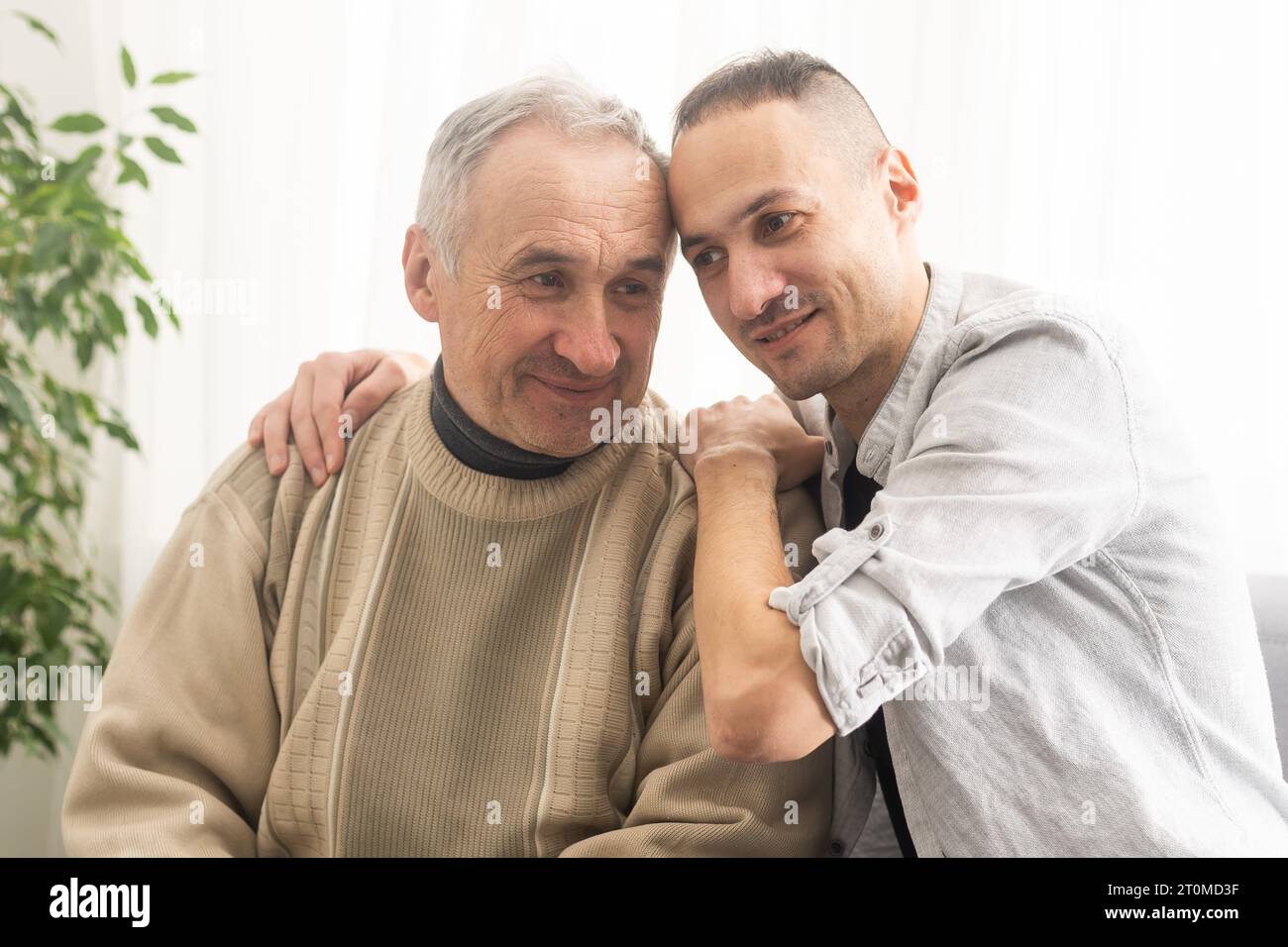Happy two generations male family old senior mature father and smiling ...