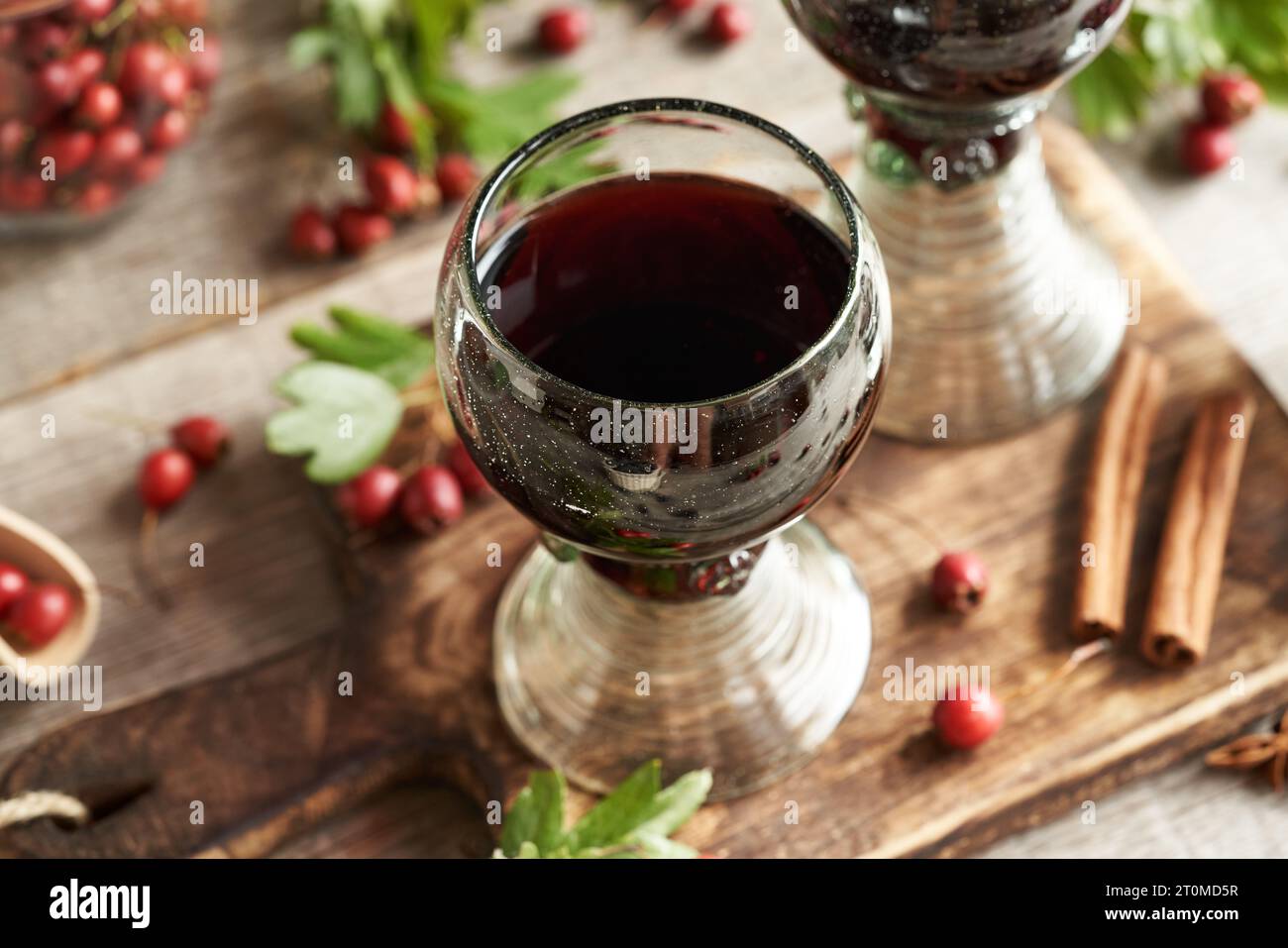 Medicinal wine prepared from fresh hawthorn berries in a cup made of so ...