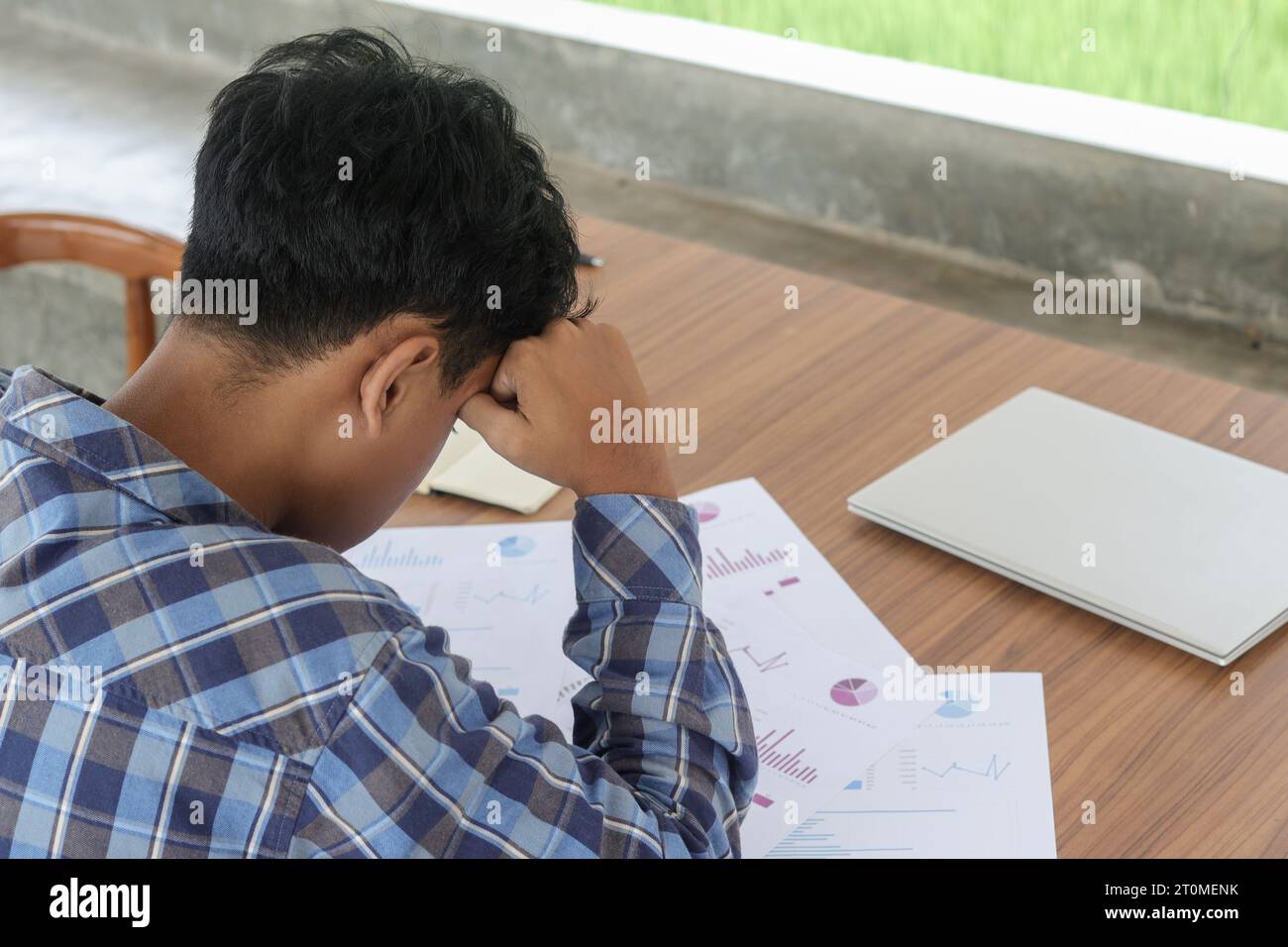 Confused businessman looking notebook hi-res stock photography and ...