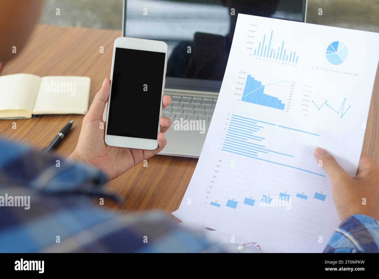 Close up of male freelance worker hand working on laptop and pointing ...