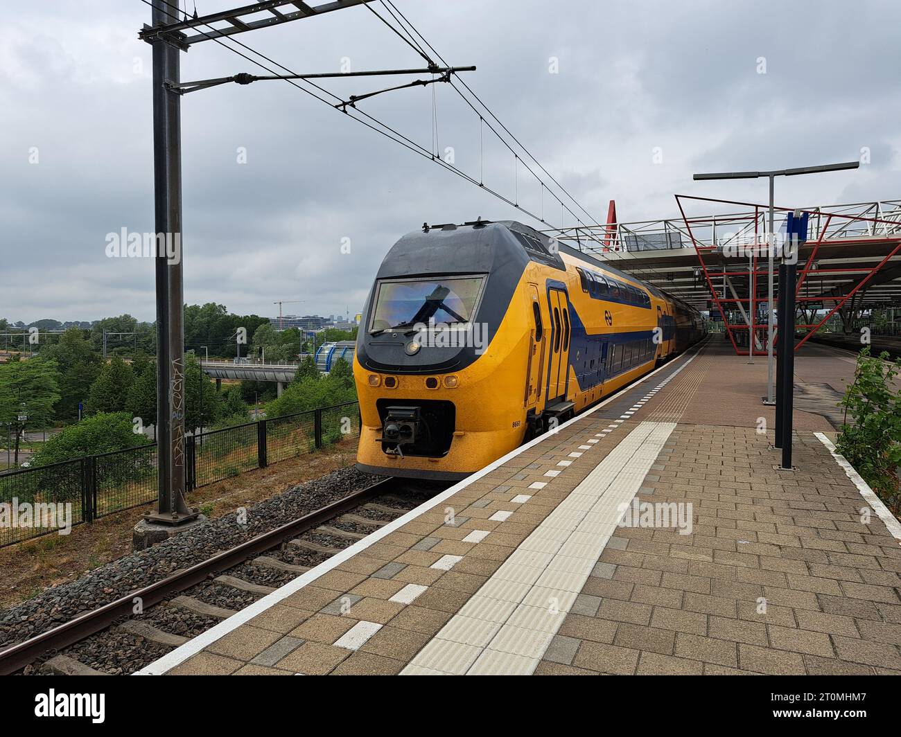 VIRM doubledeck intercity train along platform in Duivendrecht in the ...
