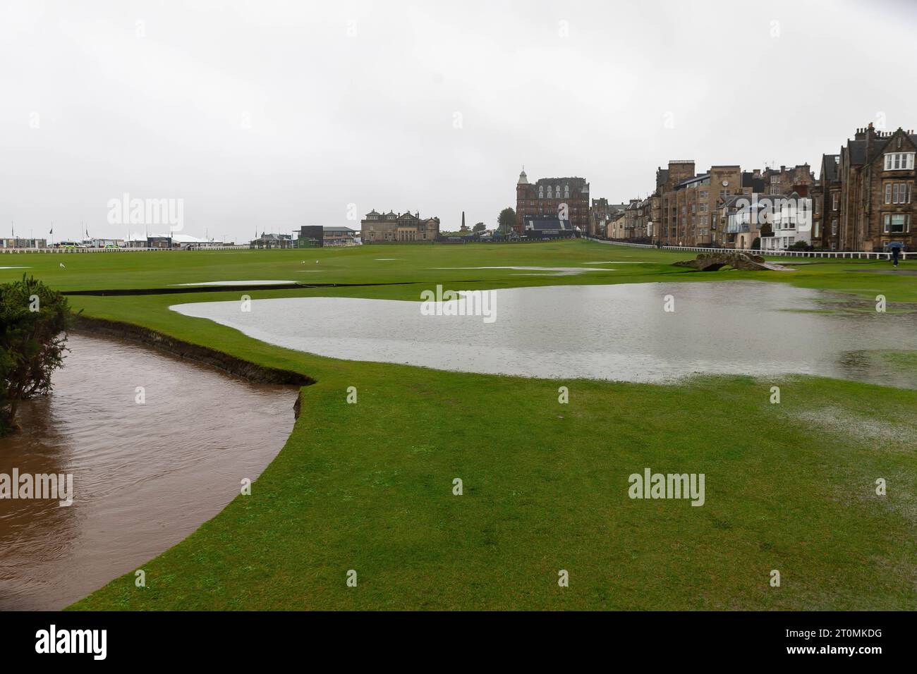 St Andrews, UK. 8th Oct, 2023. The Swilken Burn is almost overflowing ...